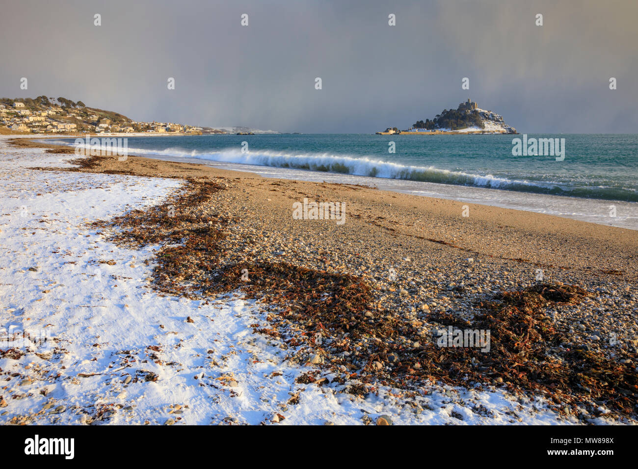 Snow on Marazion Beach in Cornwall with St Michael's Mount in the ...