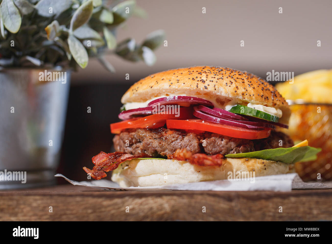 Fresh classic burger with beef, cheese, bacon, onion, tomato and ...