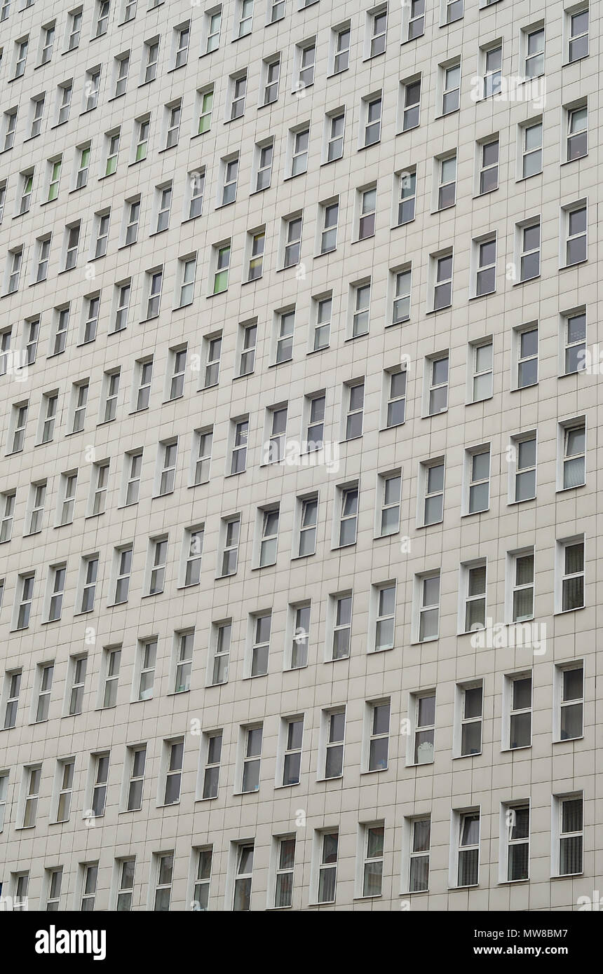 A pattern of many windows from a multi-storey office building. A large ...