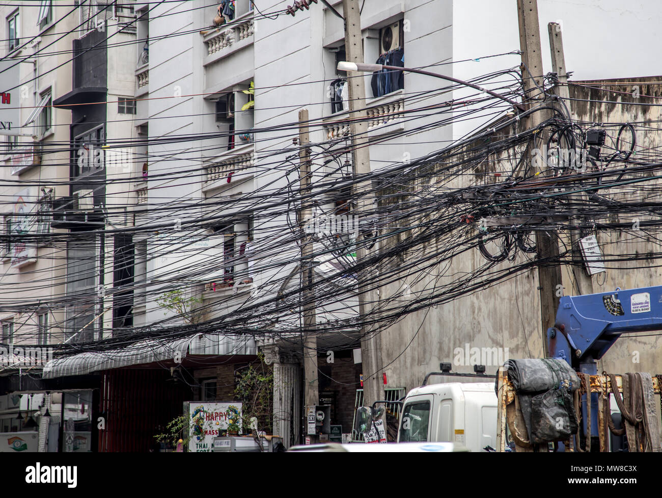 Messy wires attached electric pole hi-res stock photography and images ...