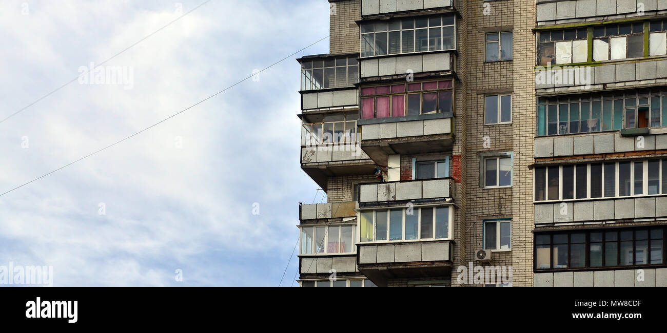 Photo of an old brick multi-storey apartment house in a poorly ...