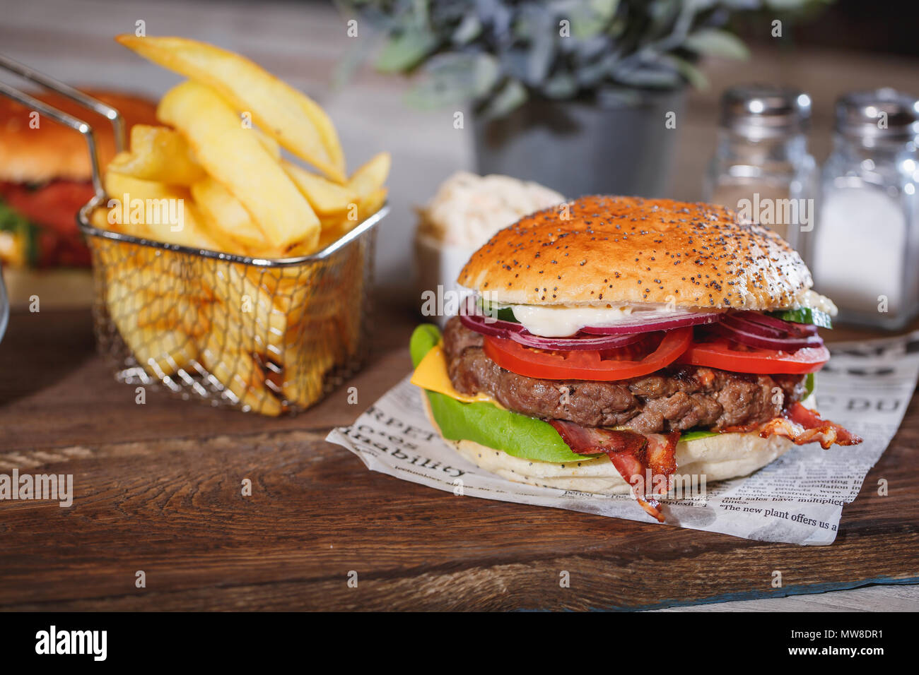 Fresh classic burger with beef, cheese, bacon, onion, tomato and ...