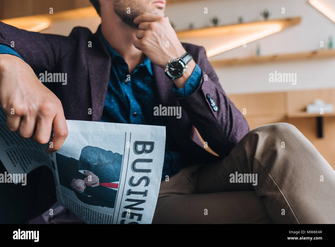 Newspaper hold man suit sit hi-res stock photography and images - Alamy