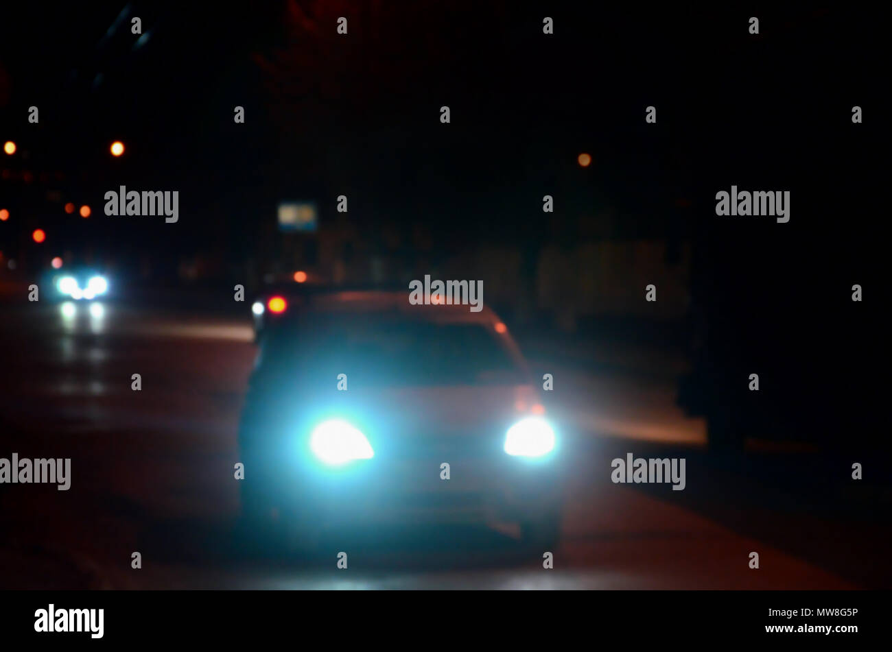 Car approaching traffic lights hi-res stock photography and images - Alamy