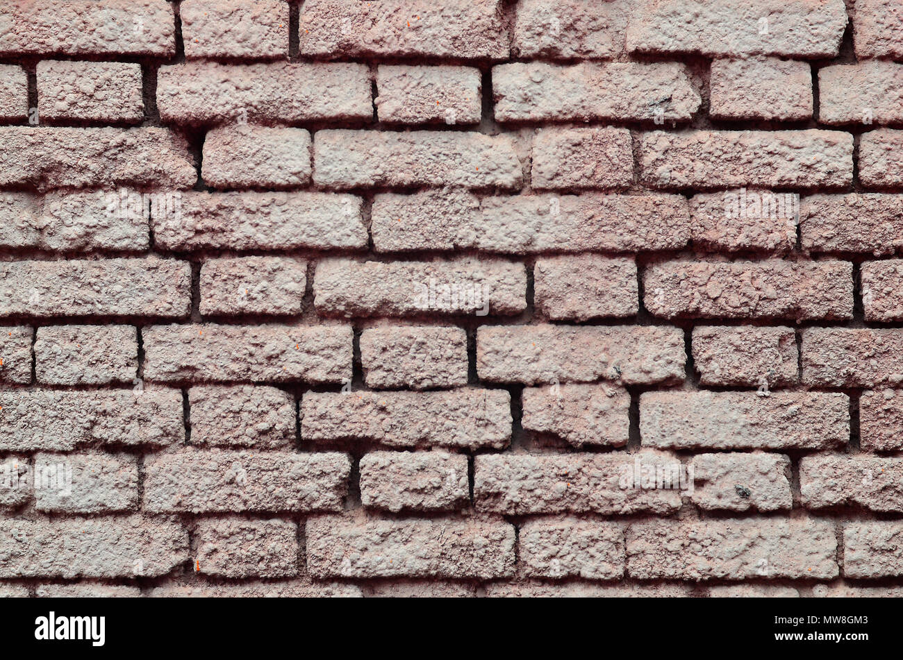 Weathered stained old brick wall background. Texture of an old wall of ...
