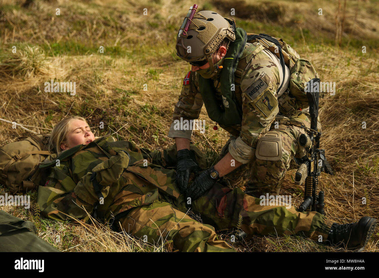 A Norwegian Coastal Ranger Commando (KJK) assesses a simulated casualty ...