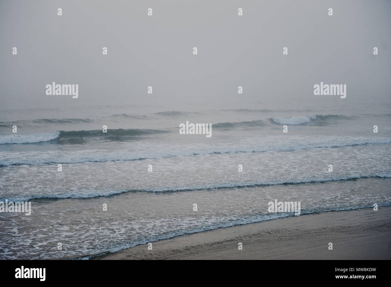 Idyllic View of Foggy Ocean Waves Stock Photo - Alamy