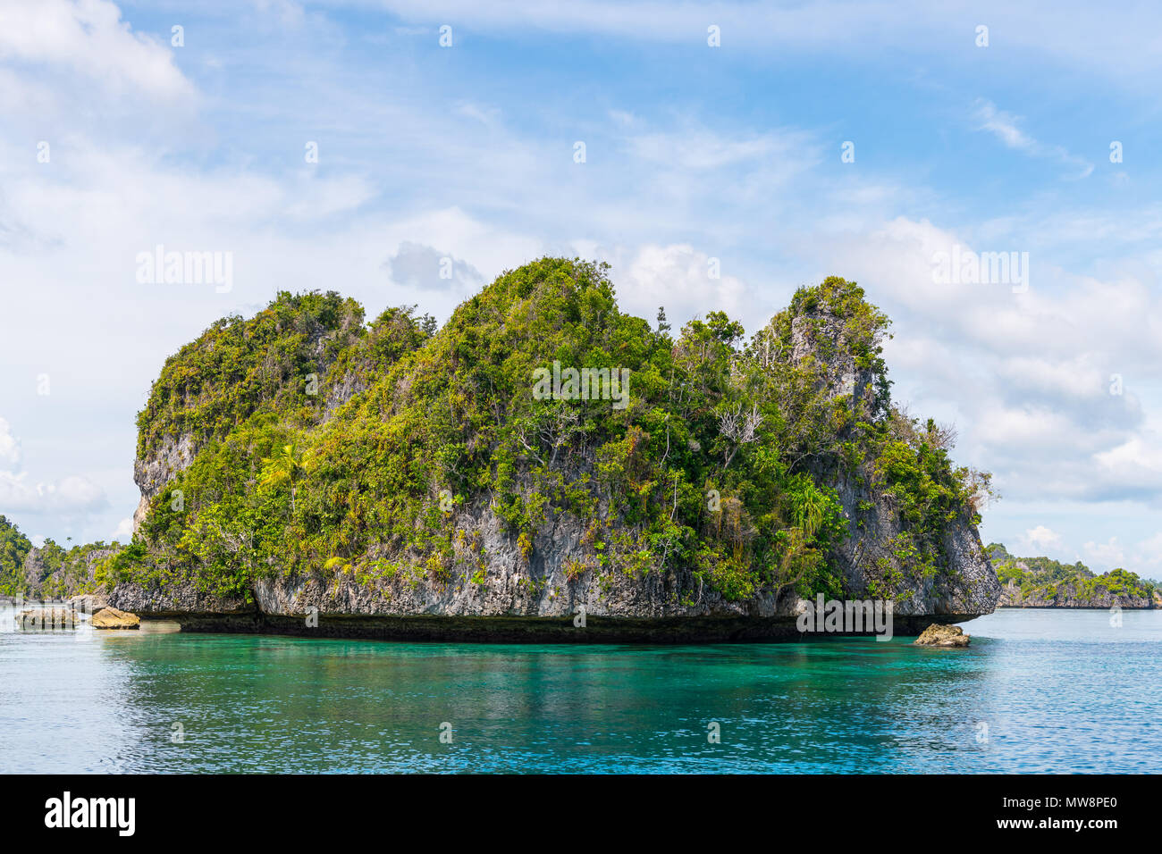 East Misool, group of small limestone islands in shallow blue lagoon ...