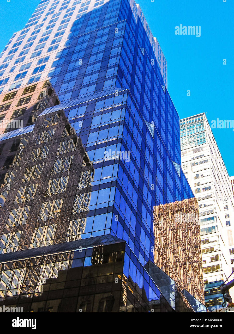 Vertical of modern shiny blue facade of high rise buildings in ...