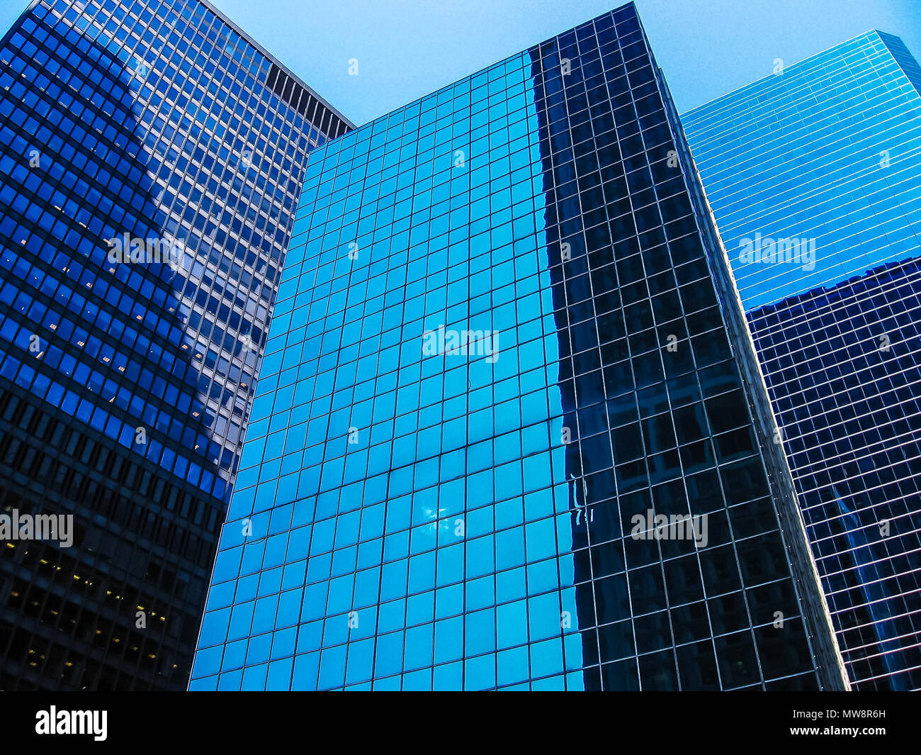 Vertical of modern shiny blue facade of high rise buildings in ...