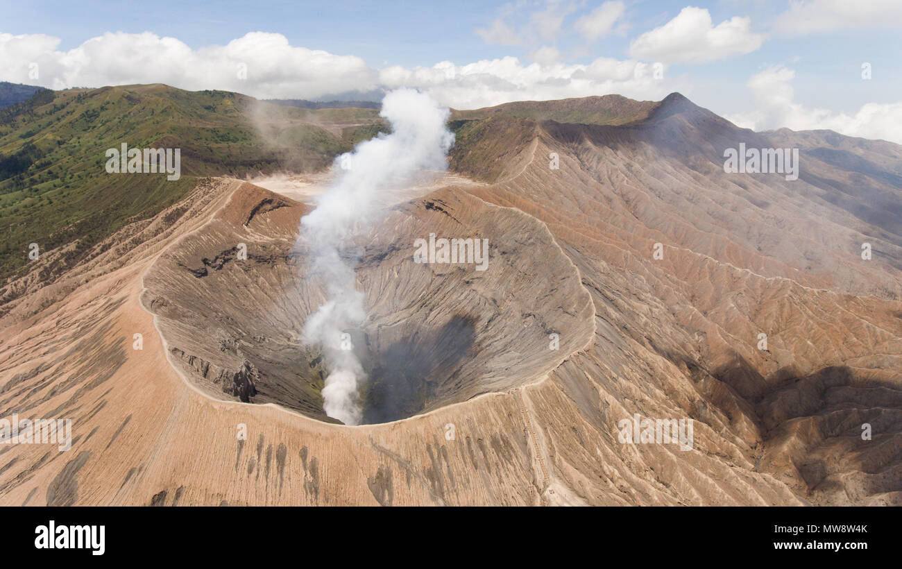 Crater with active volcano smoke in East Jawa, Indonesia. Aerial view ...