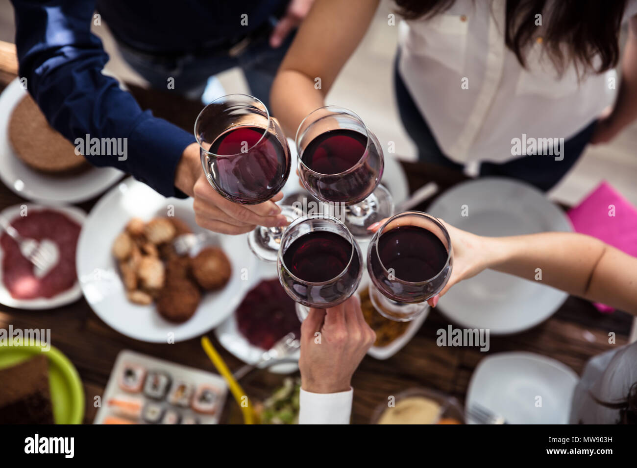 Closeup cheerful people toasting hi-res stock photography and images ...