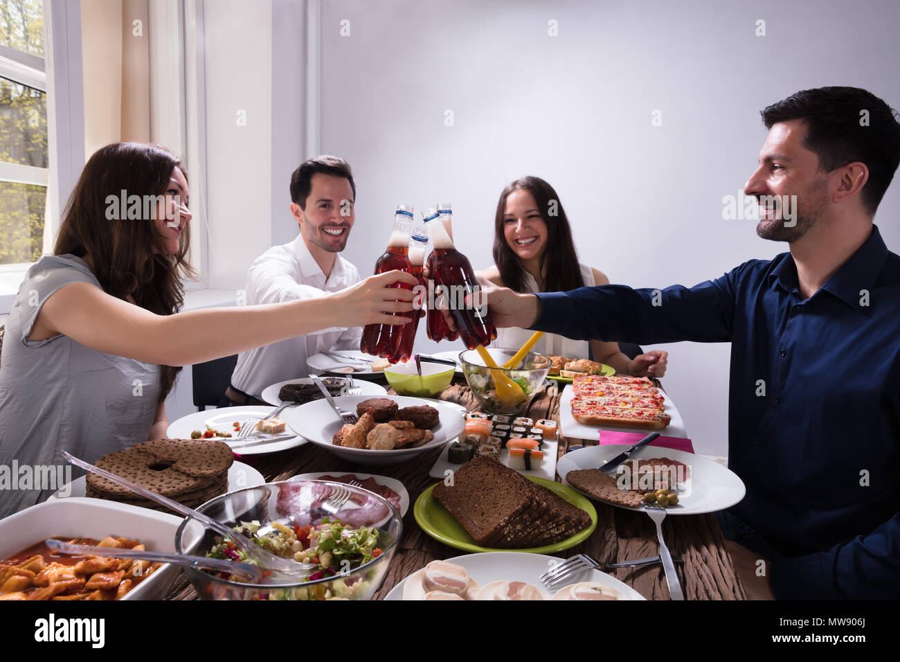 Friends toasting lunch hi-res stock photography and images - Alamy