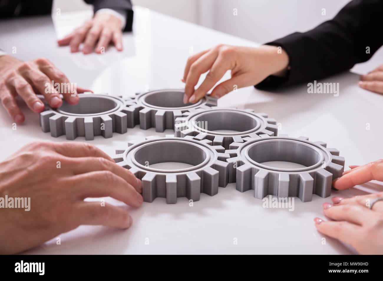 Business people teamwork gear together hi-res stock photography and ...