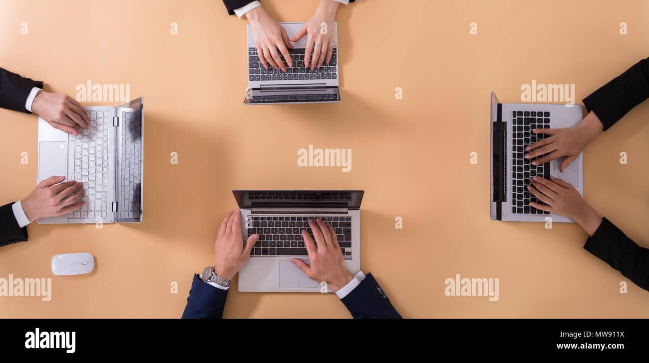 Group working with laptops hi-res stock photography and images - Alamy
