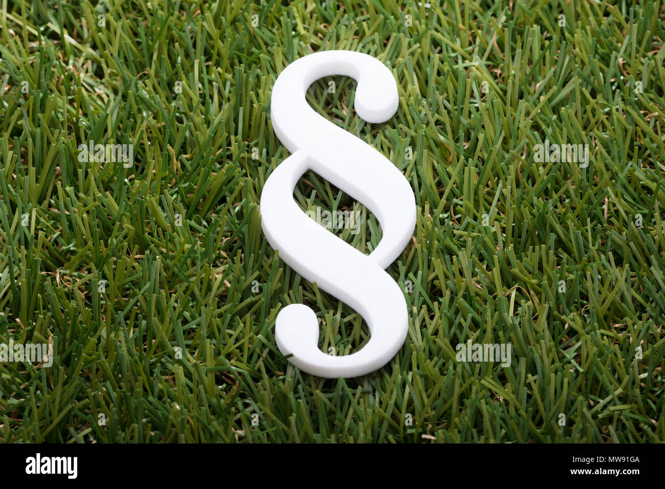 High Angle View Of White Paragraph Symbol On Green Grass Stock Photo ...
