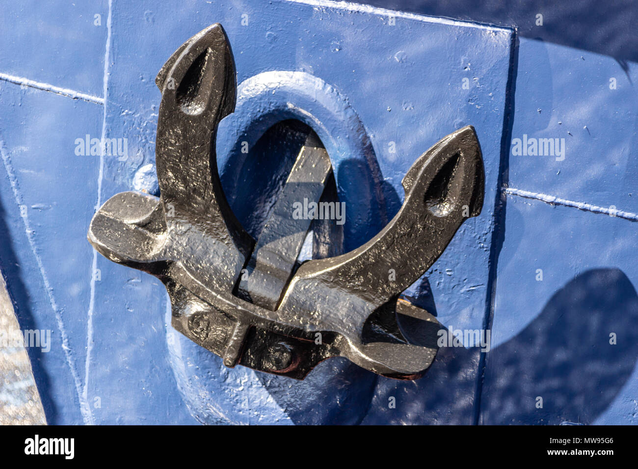 Anchor against a blue ship, close-up Stock Photo - Alamy