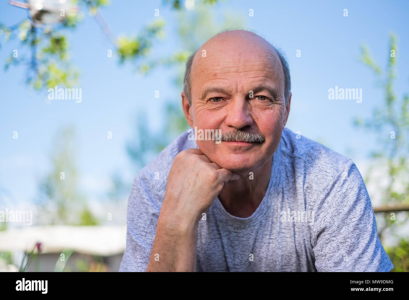 Elderly man resting on grass hi-res stock photography and images - Alamy