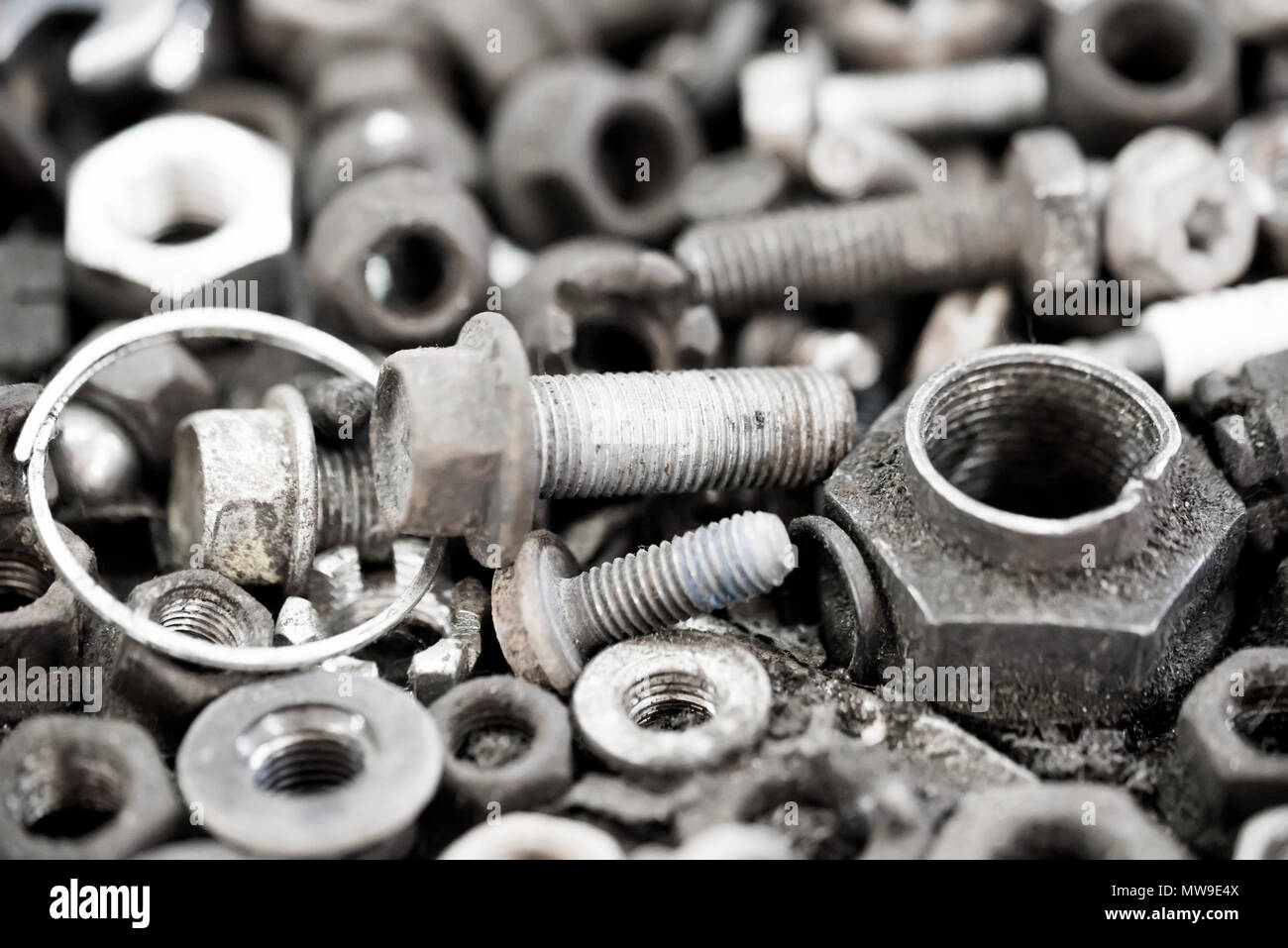 Close-up of used steel bolts background Stock Photo - Alamy