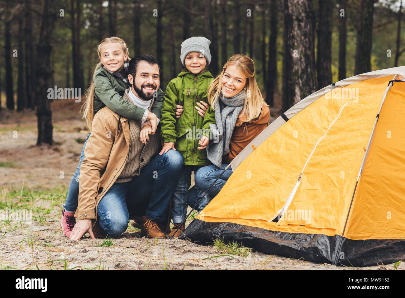 happy family having camping trip together in forest Stock Photo - Alamy