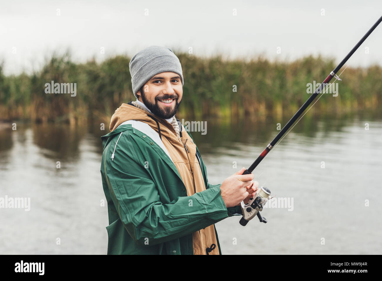 Bearded man fishing on river hi-res stock photography and images - Alamy