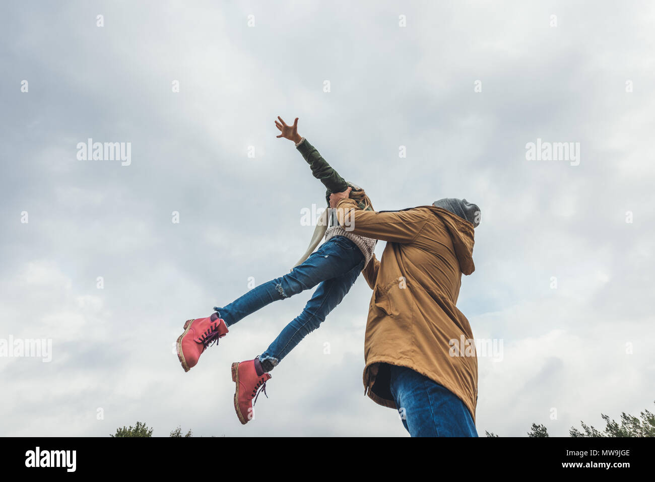 Father holding up daughter sky hi-res stock photography and images - Alamy