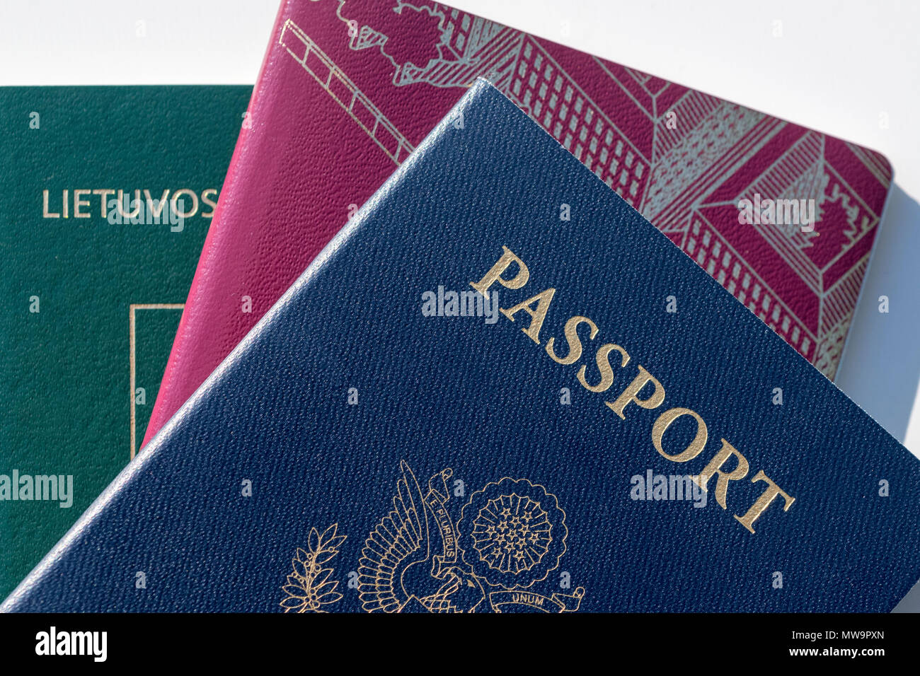 Dark blue US Passport Alongside EU Style Red and Green Passports Stock ...