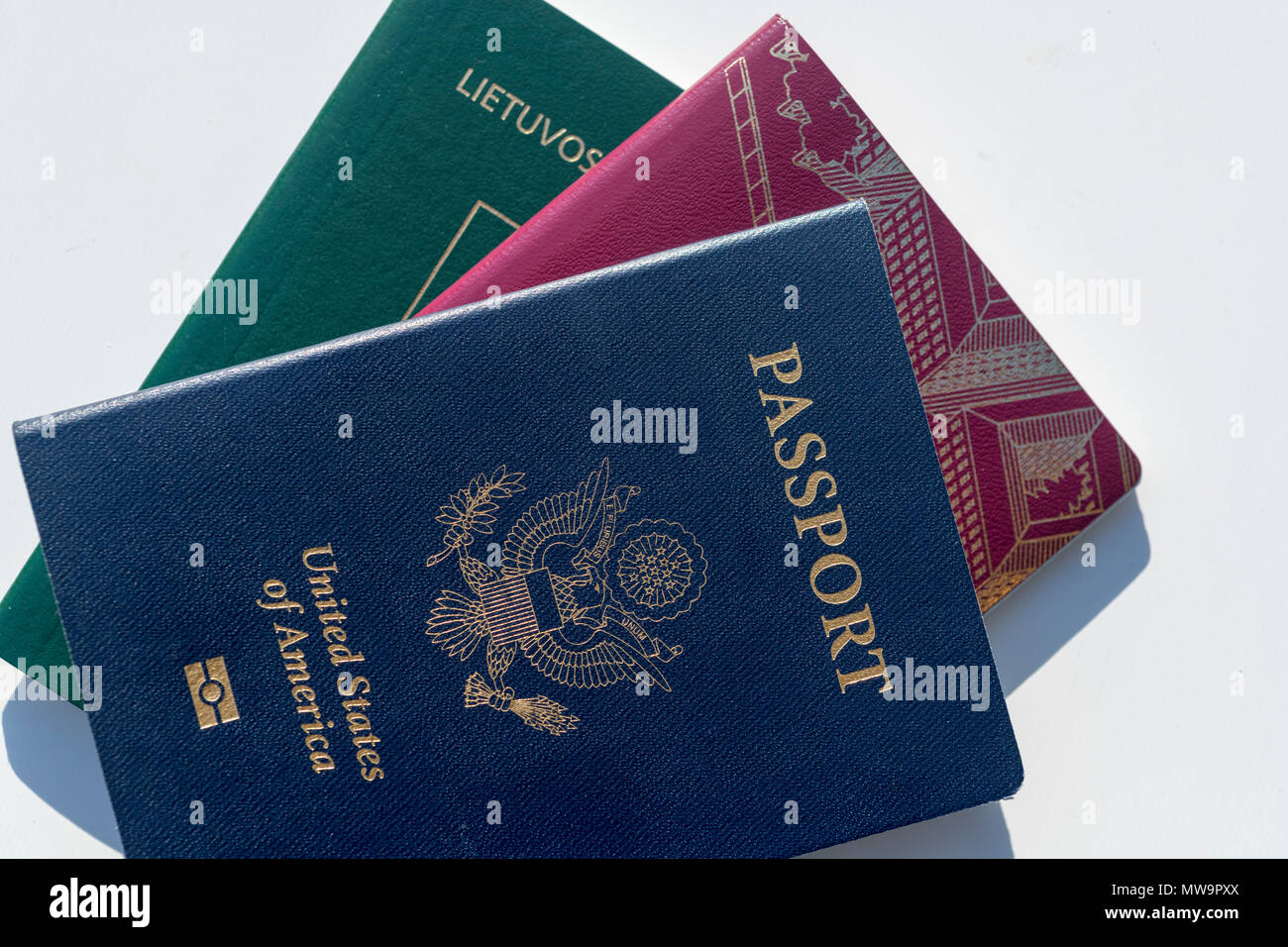 Dark blue US Passport Alongside EU Style Red and Green Passports Stock ...