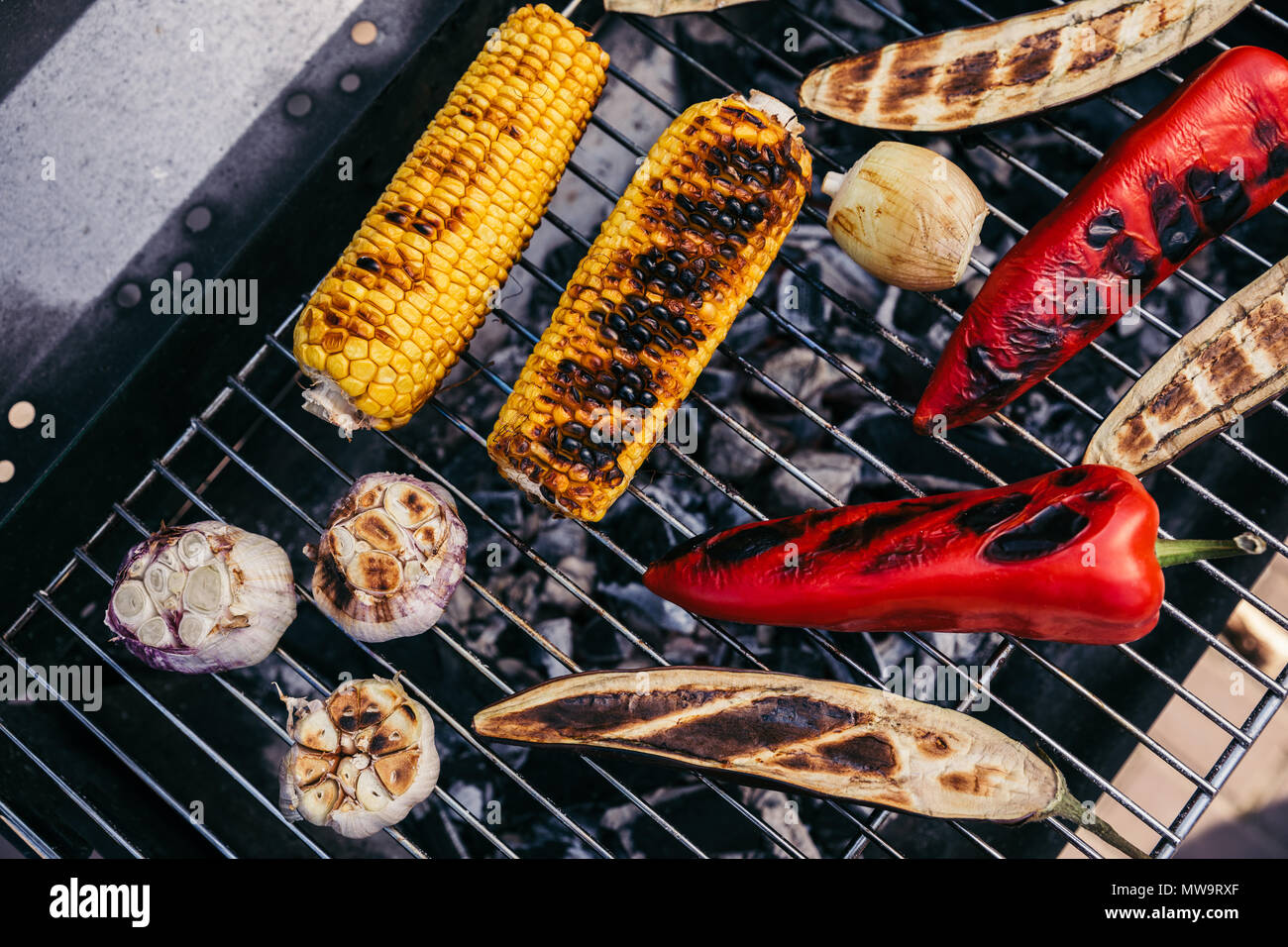 Vegetables and garlic grilled for outdoors barbecue Stock Photo - Alamy