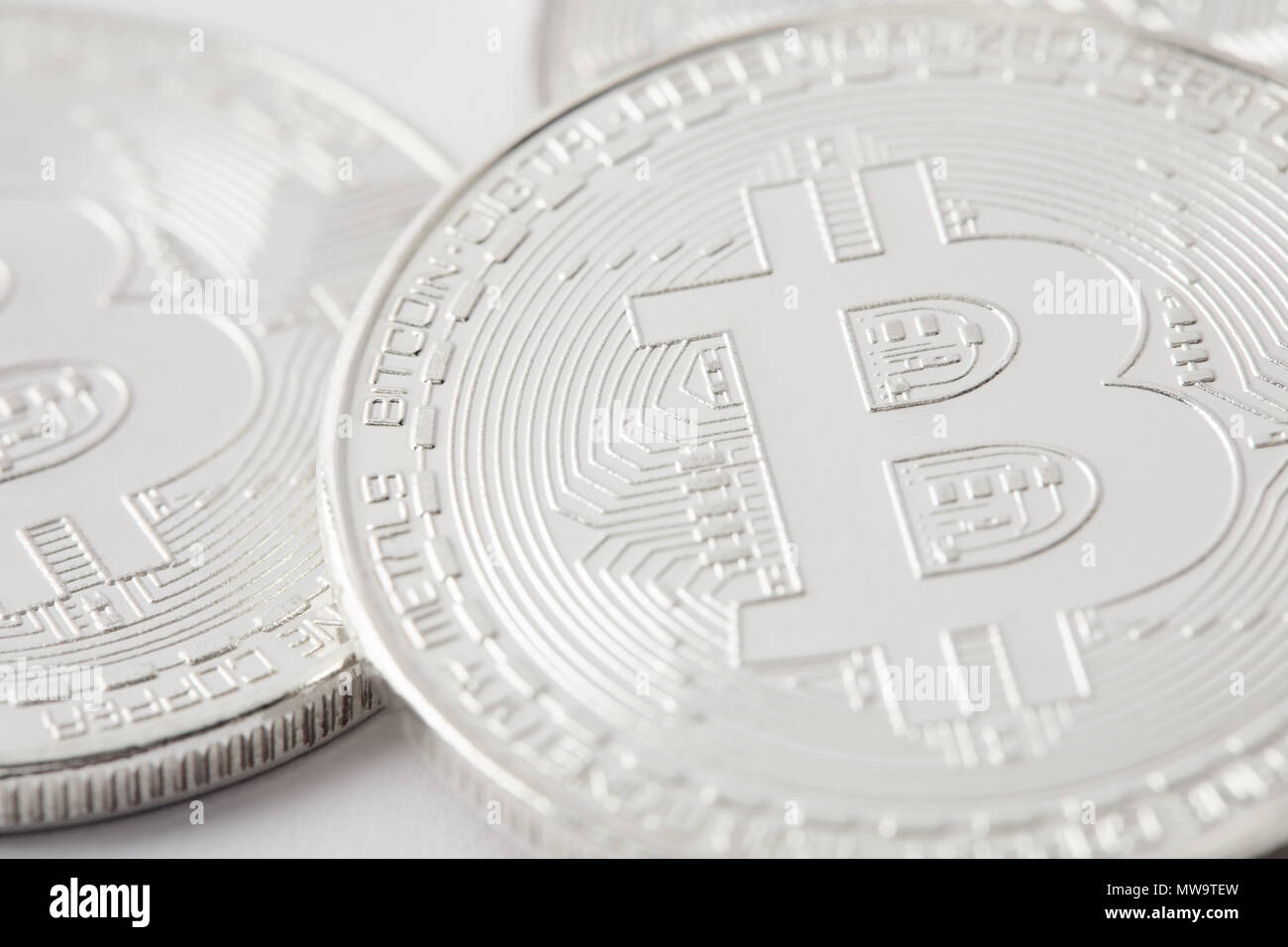close-up shot of pile silver bitcoins Stock Photo - Alamy