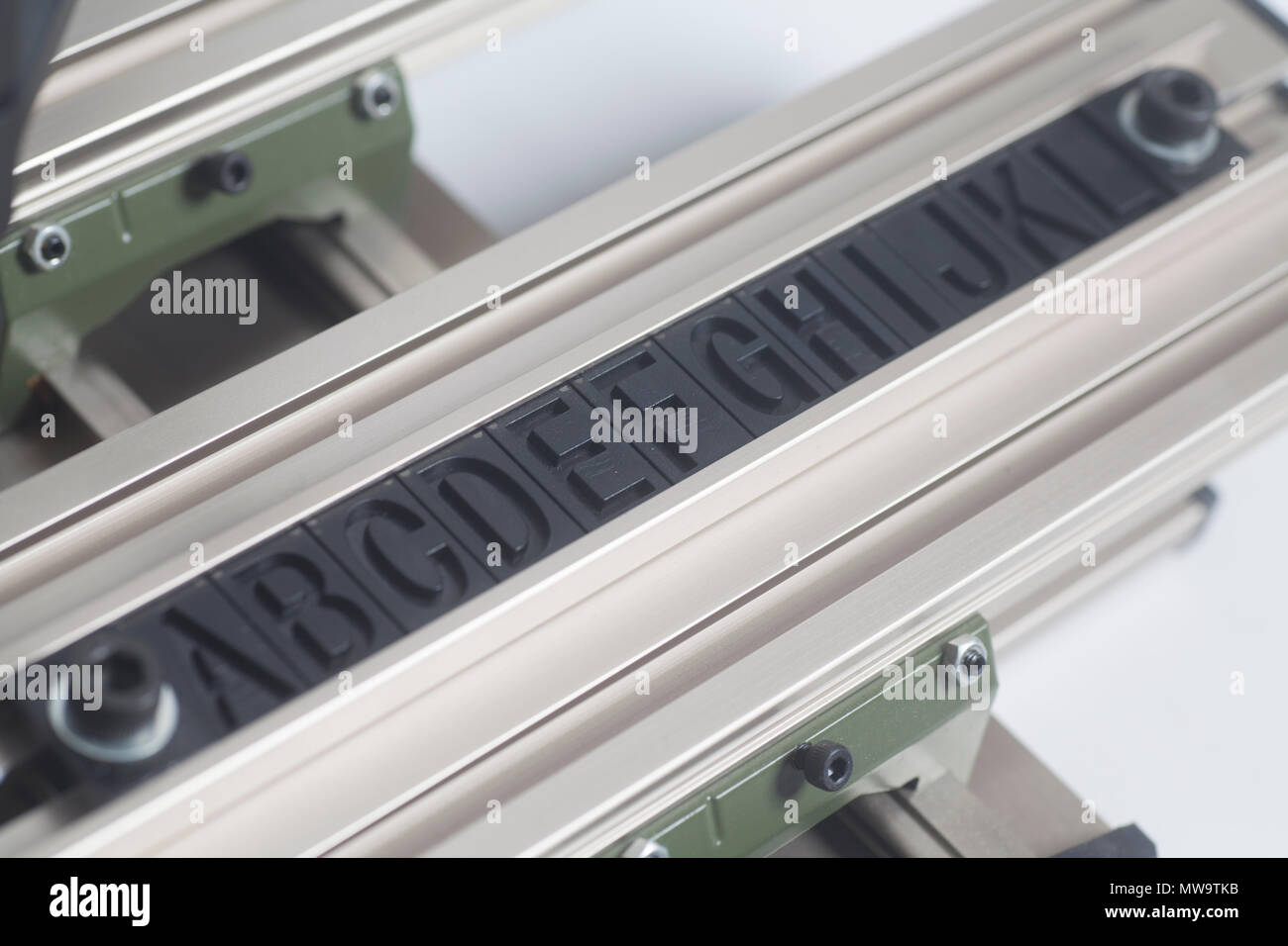 Engraving device pantograph with letterpress alphabet on a white ...