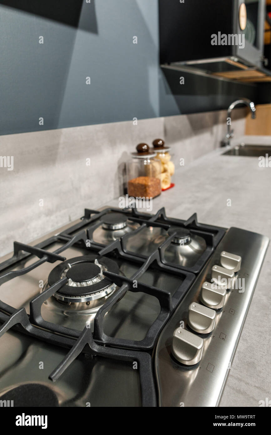 Interior of modern kitchen with metal stove on counter Stock Photo - Alamy