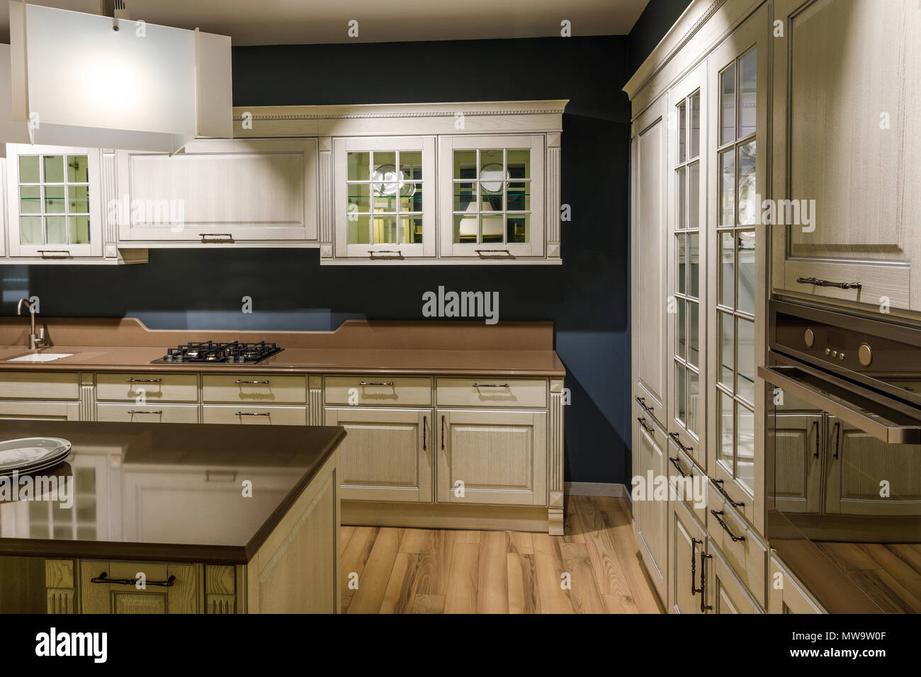 Stylish kitchen with elegant wooden counter Stock Photo - Alamy