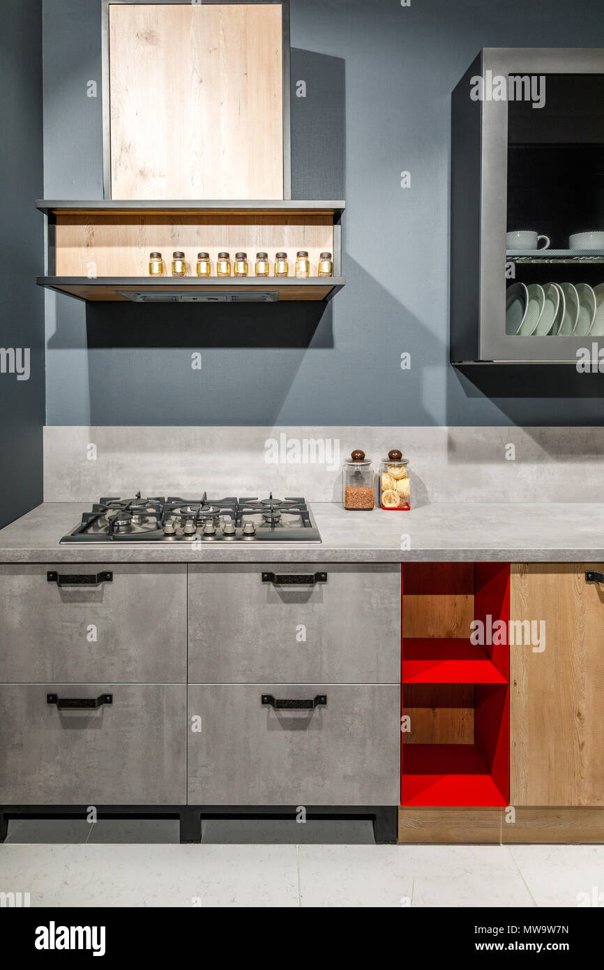 Stylish kitchen with elegant grey counter and stove Stock Photo - Alamy