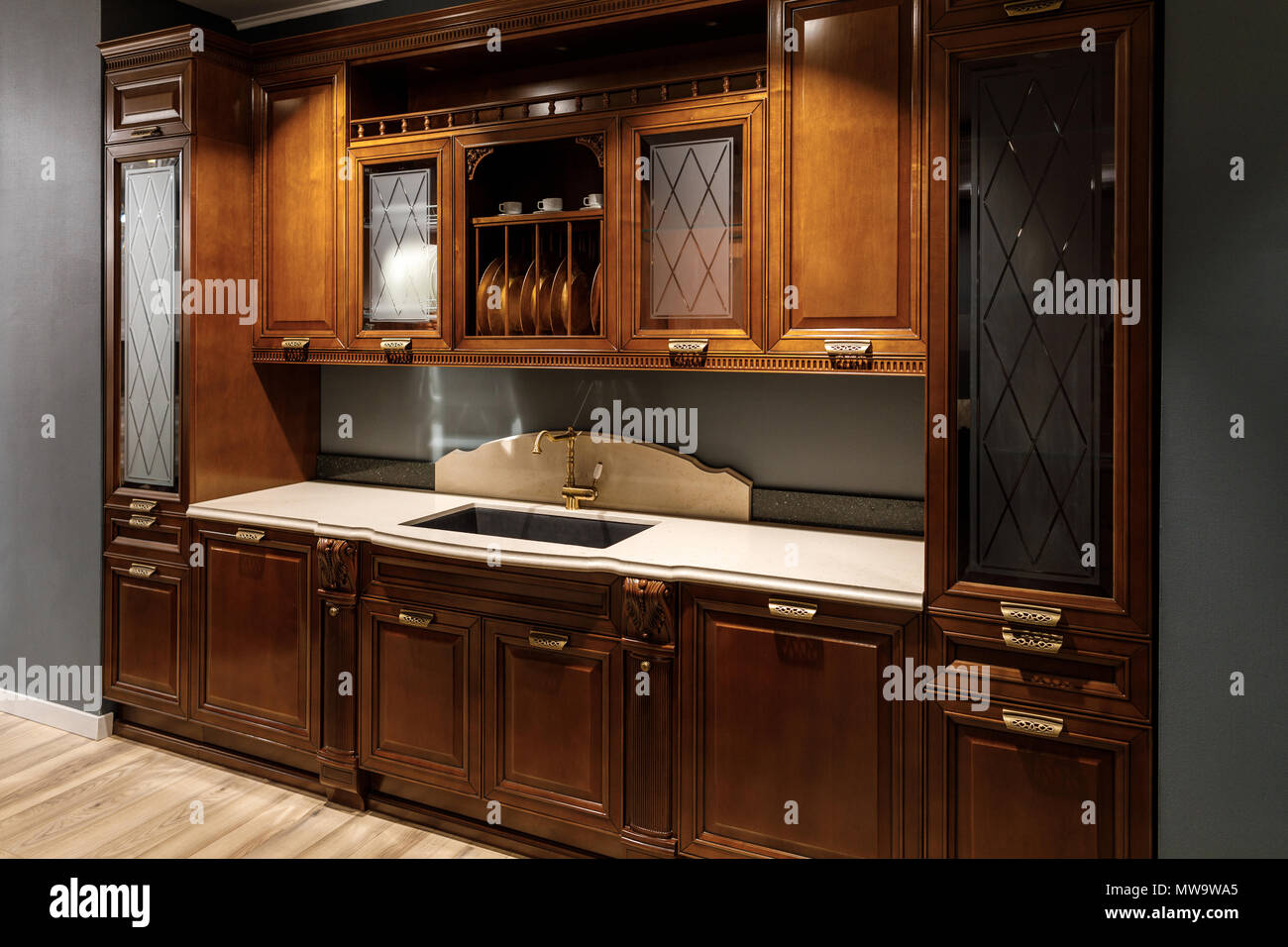 Renovated kitchen interior with wooden cabinets and sink Stock Photo ...