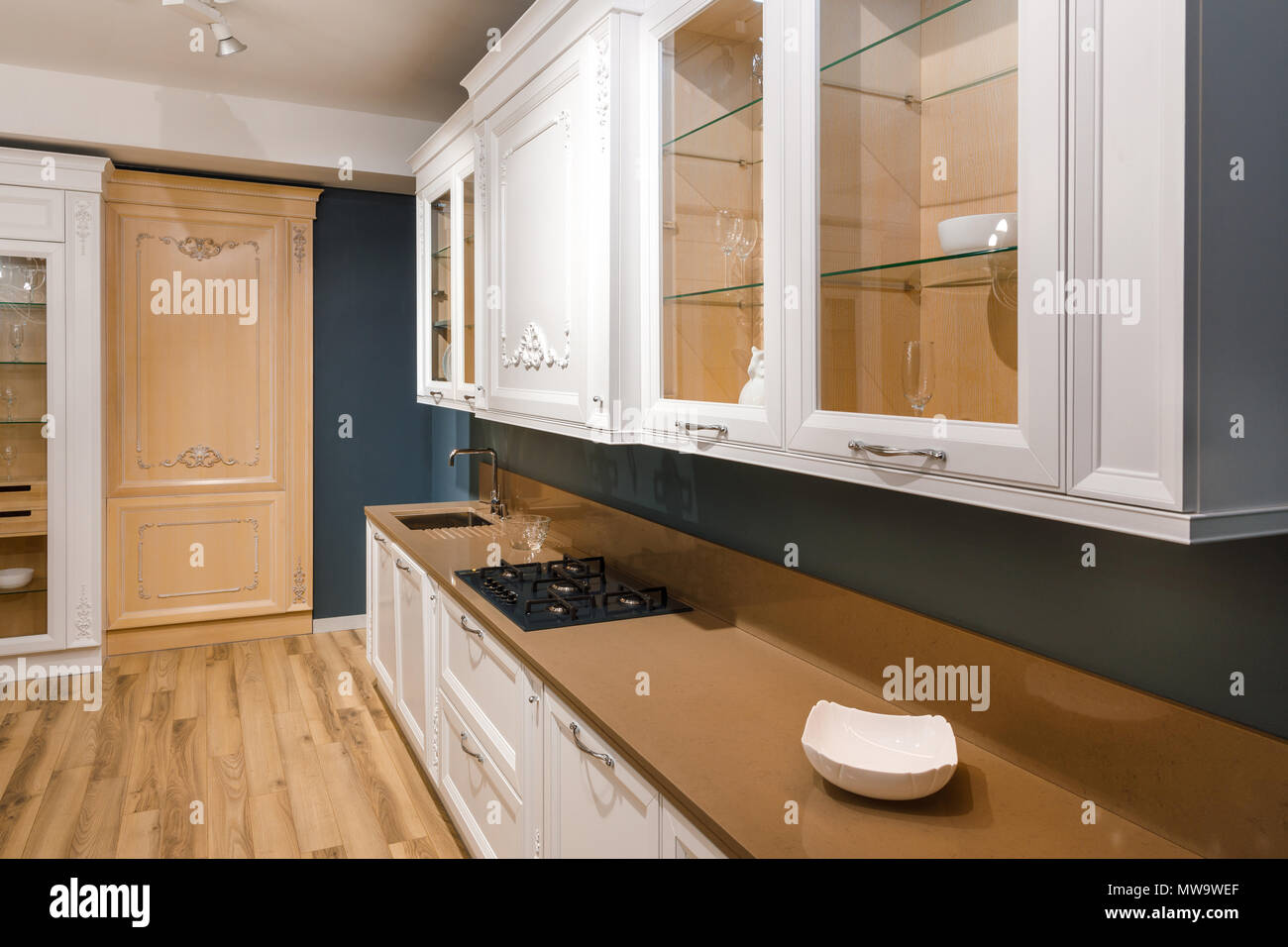 Interior of modern kitchen with stylish design and stove on counter ...