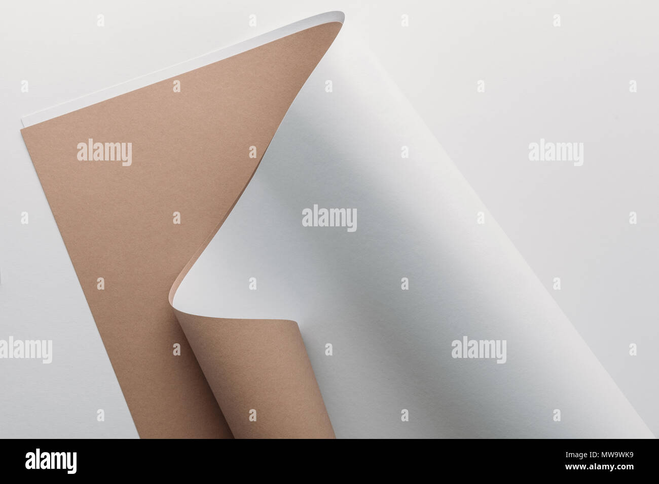 white and brown paper sheets on grey background Stock Photo - Alamy