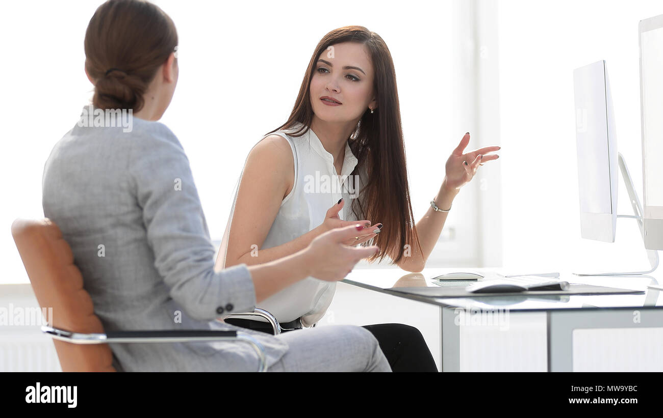 two office workers talking in the workplace Stock Photo - Alamy