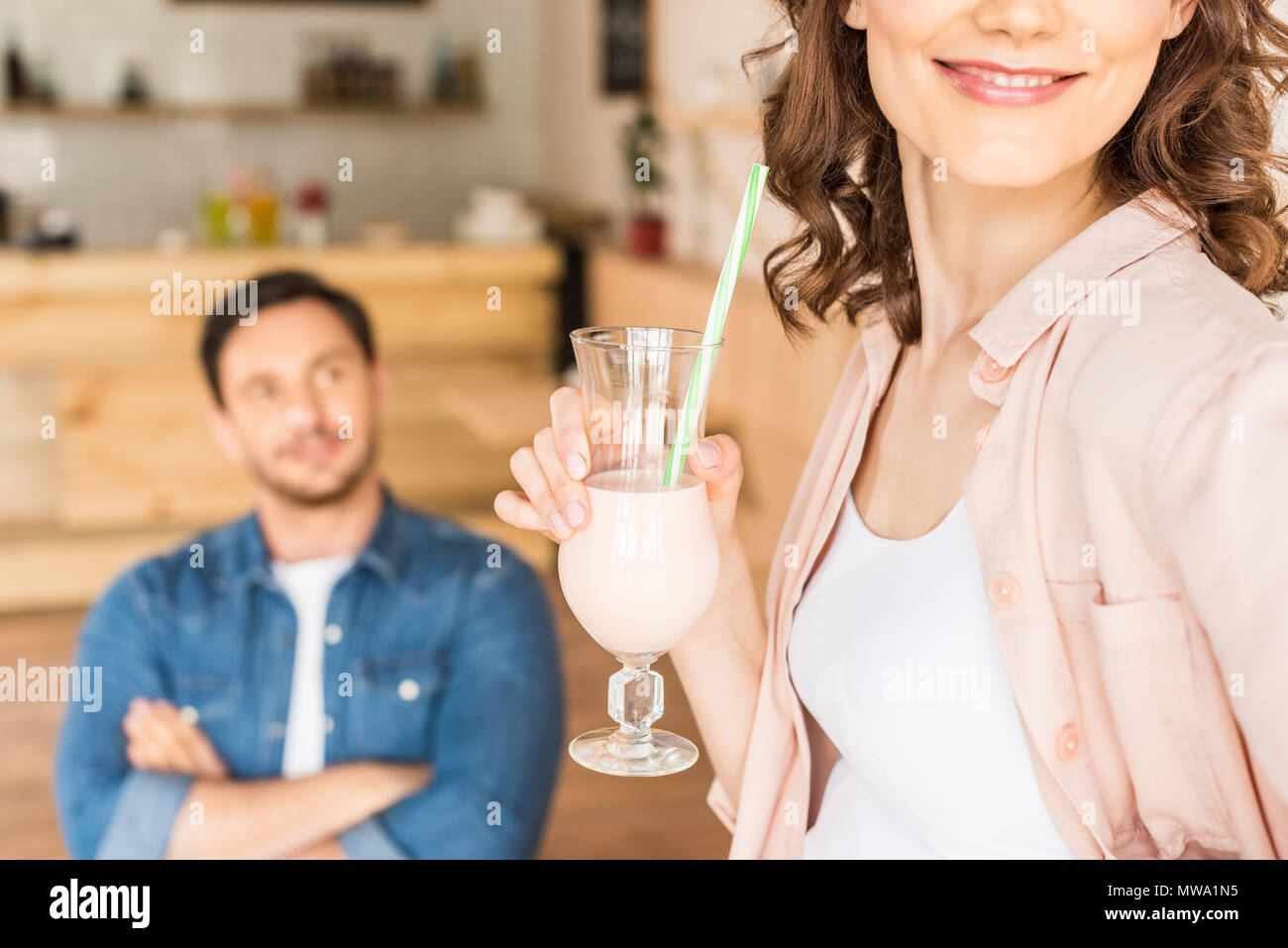 Woman with cocktail in hand hi-res stock photography and images - Alamy