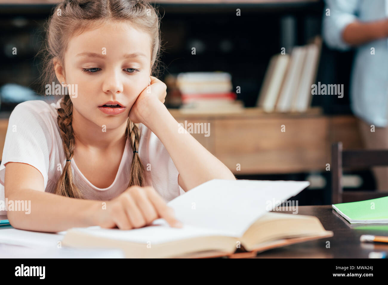 cute little girl reading book Stock Photo - Alamy