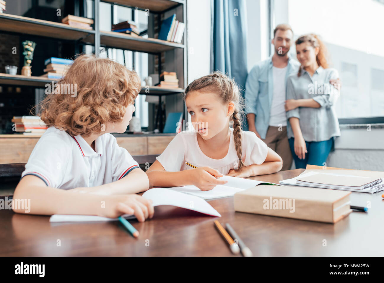 cute little kids doing homework together Stock Photo - Alamy