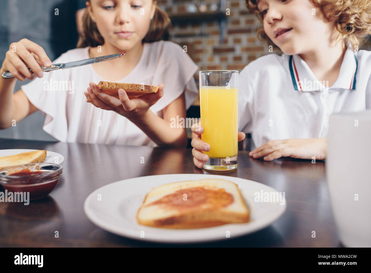 School boy and girl drink juice hi-res stock photography and images - Alamy