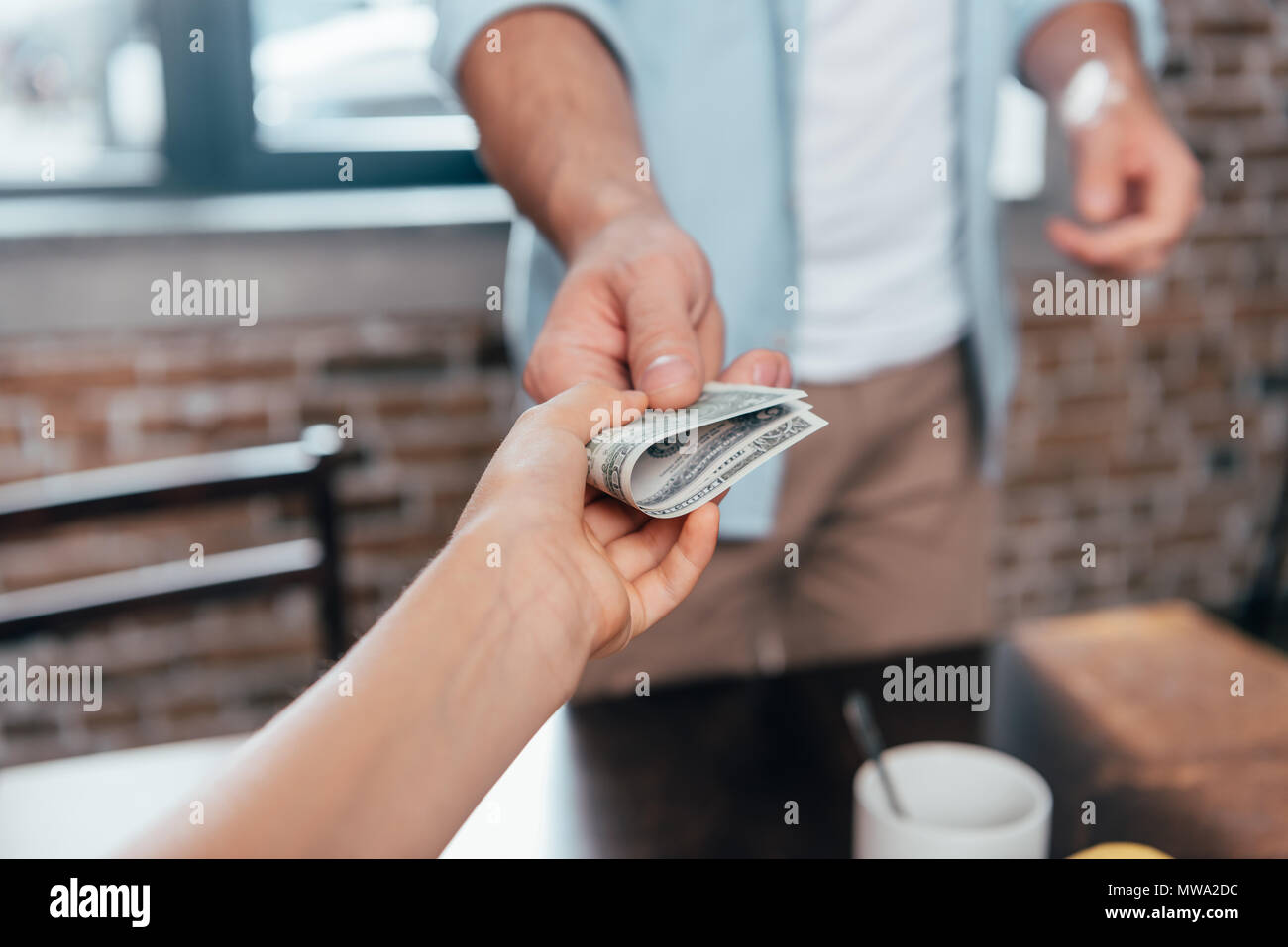 Father giving daughter money hi-res stock photography and images - Alamy