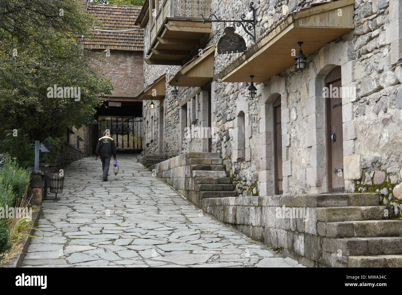Traditional stone and wooden buildings, now used as shops, eateries ...