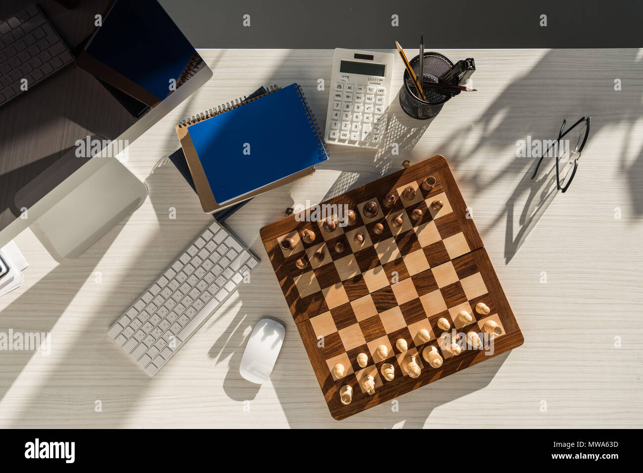 top view of chess board at workplace with computer Stock Photo - Alamy