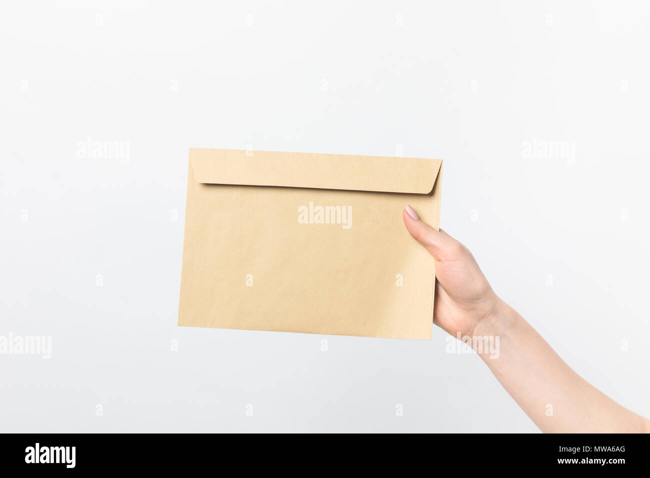 Envelope in hand hi-res stock photography and images - Alamy
