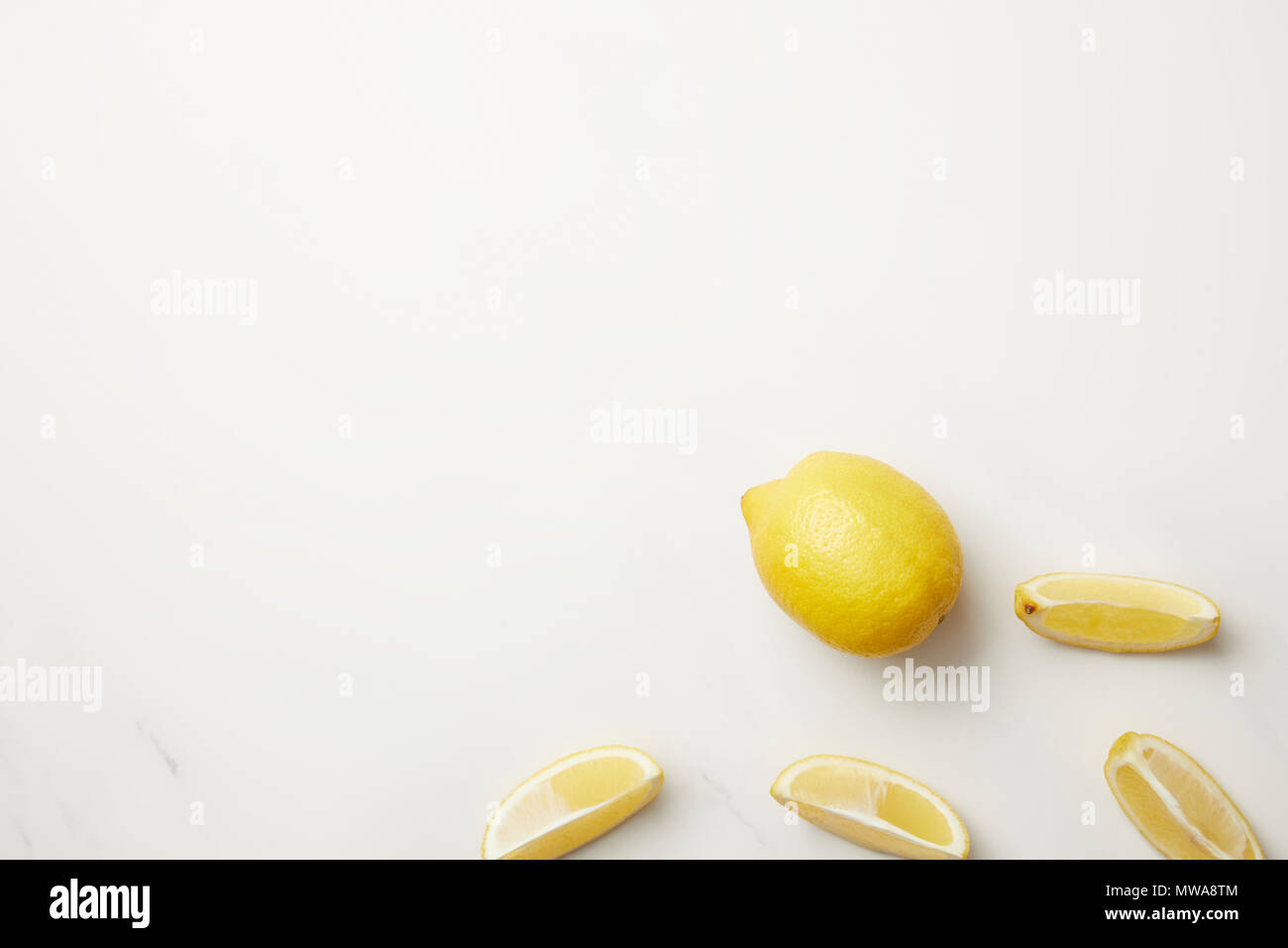 Ripe yellow whole fruit and slices of lemon isolated on white Stock ...
