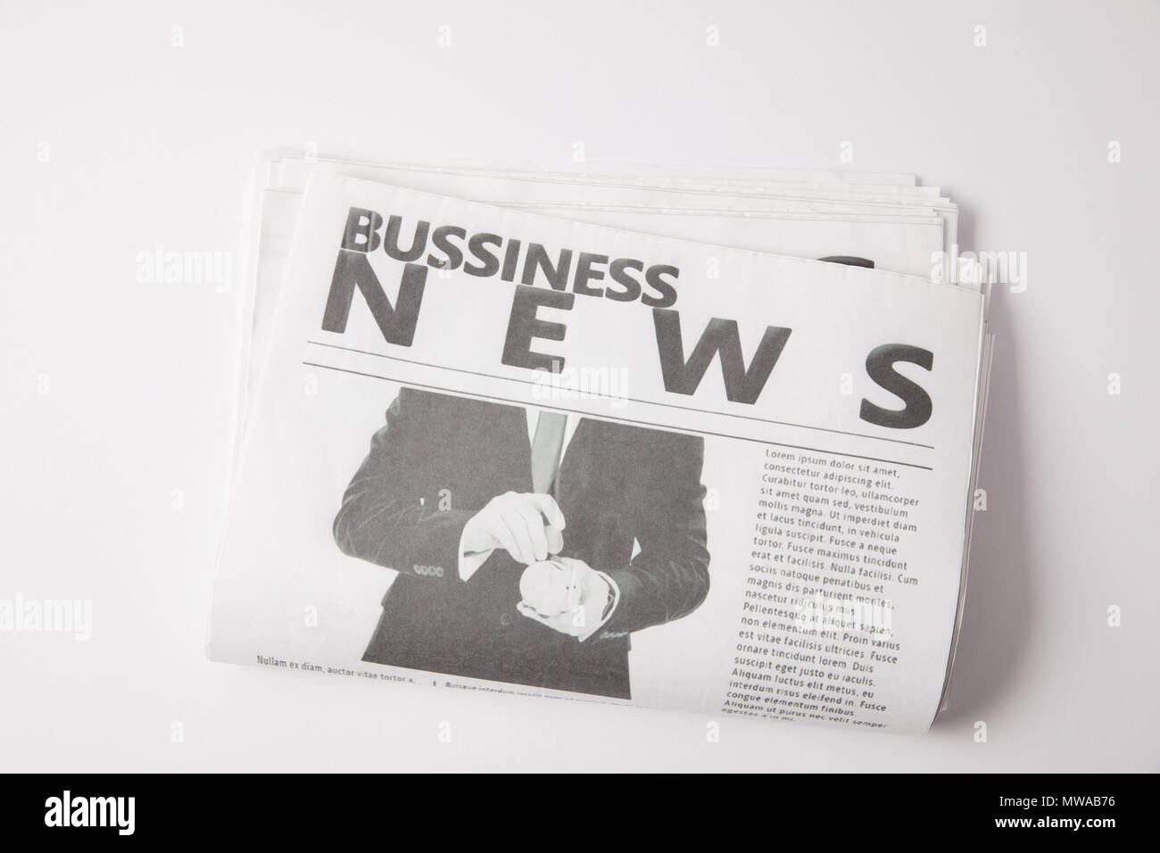 one business newspaper lying on white background Stock Photo - Alamy