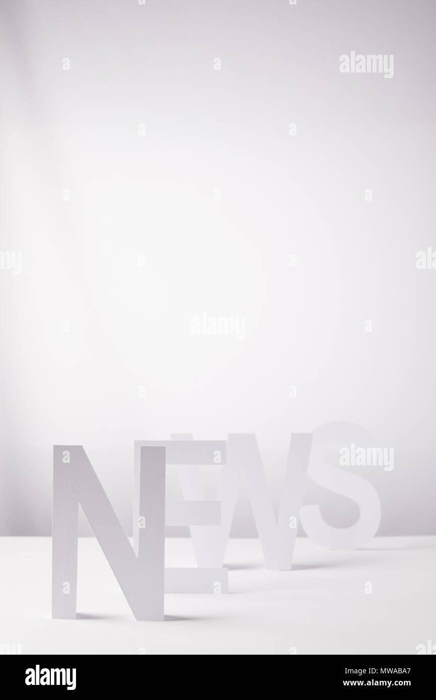 white word news made of paper letters, on white background with copy ...