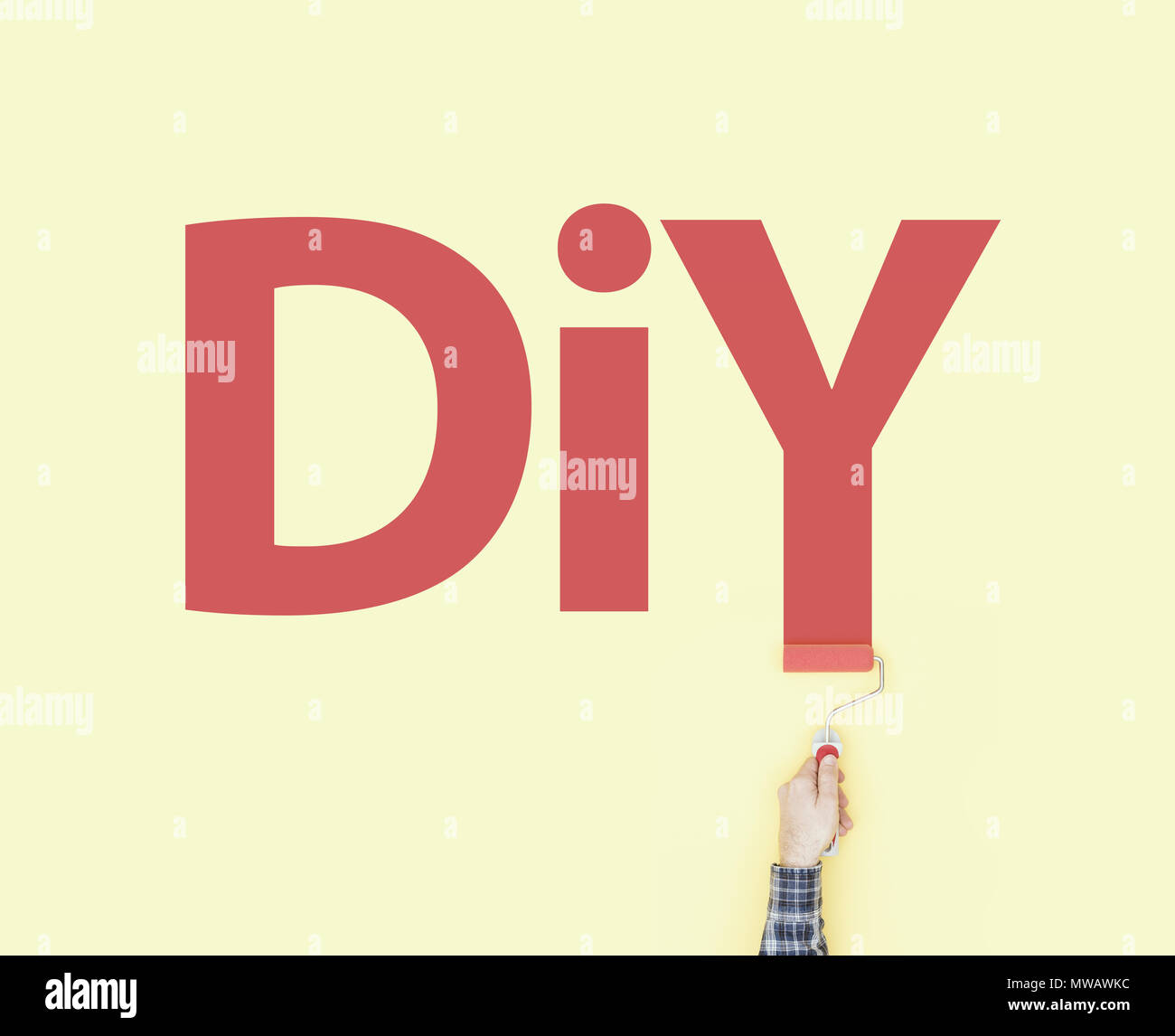 Decorator writing DIY on a wall using a paint roller, creativity and do ...